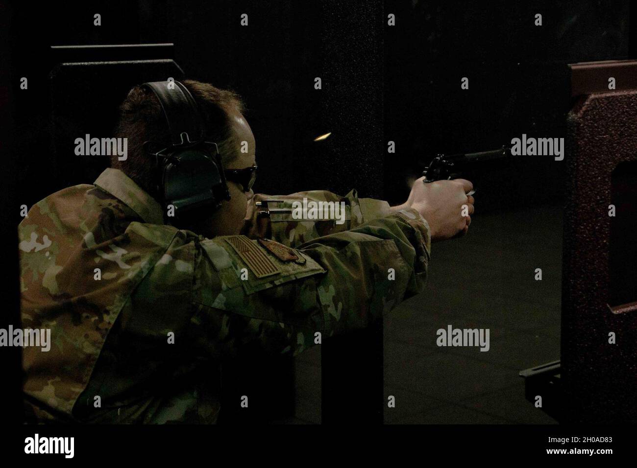 Col. Brandon Eskam, 114th Fighter Wing vice commander, shoots the M9 at ...