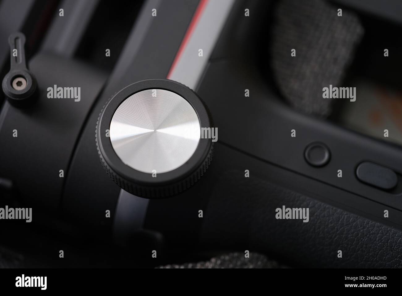 Closeup of metal button on control panel Stock Photo - Alamy