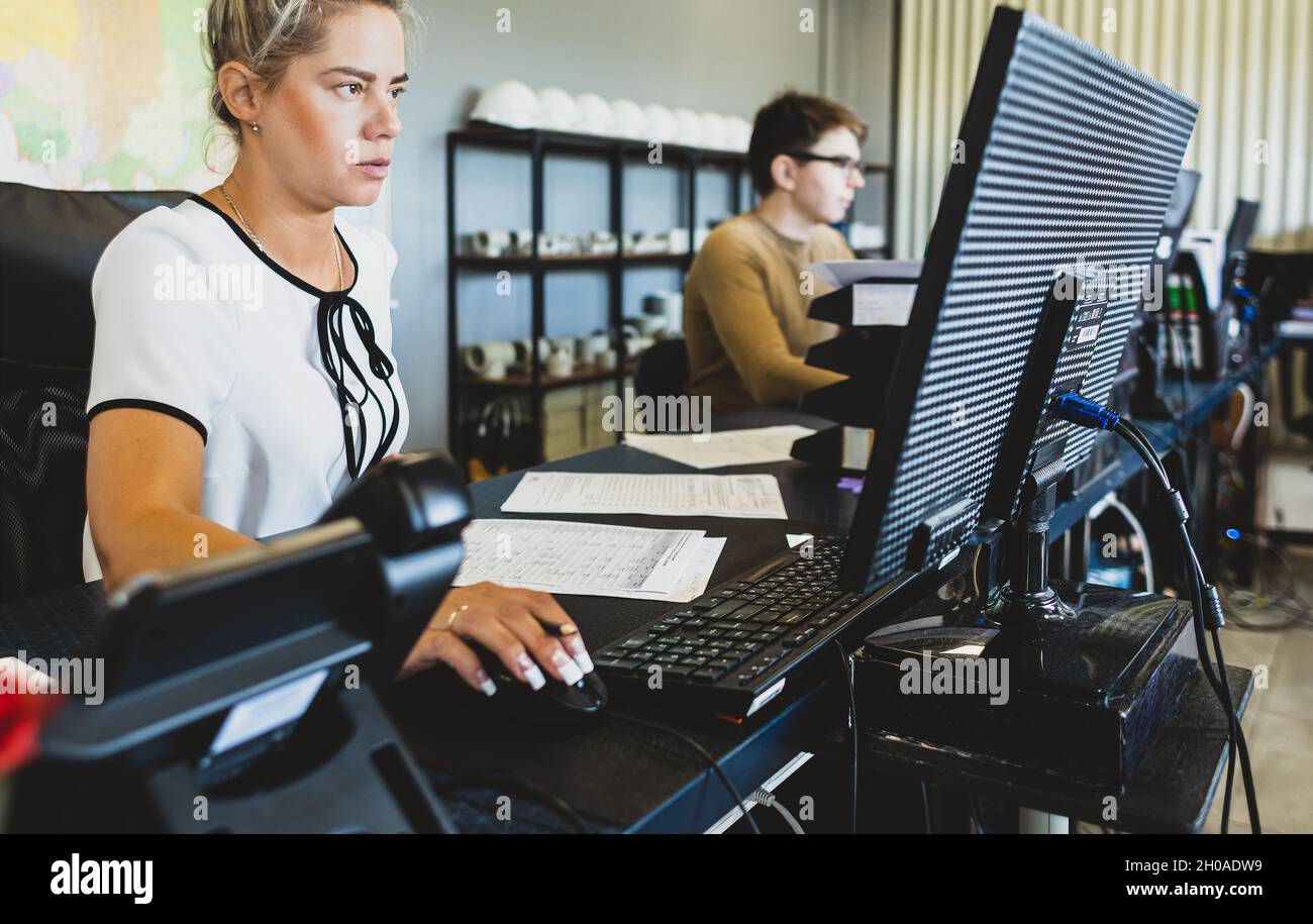 Engineer designer working on desktop computer in factory Stock Photo ...