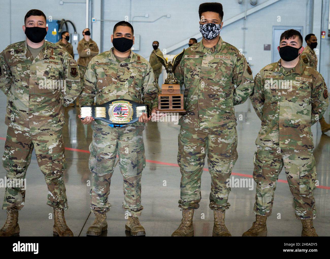 Members of the 20th Aircraft Maintenance Unit pose for a picture with ...