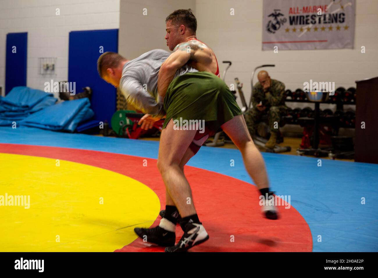 U.S. Marine Corps, Sgt. Joshua Medina, right, throws Pfc. Thomas Hicks ...