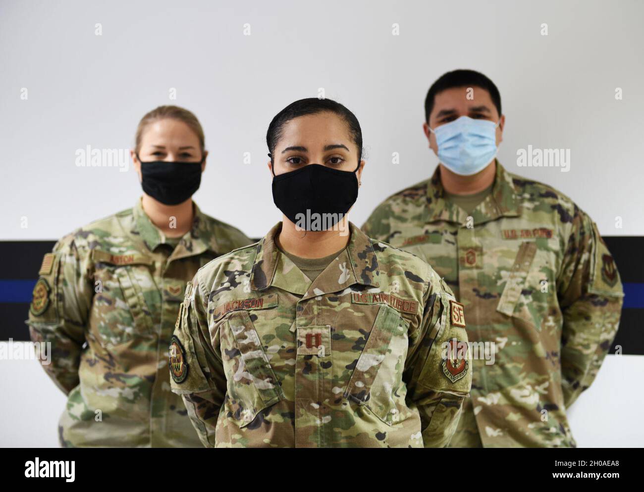 U.S. Air Force Capt. Raven Jackson is joined by two members of her team ...