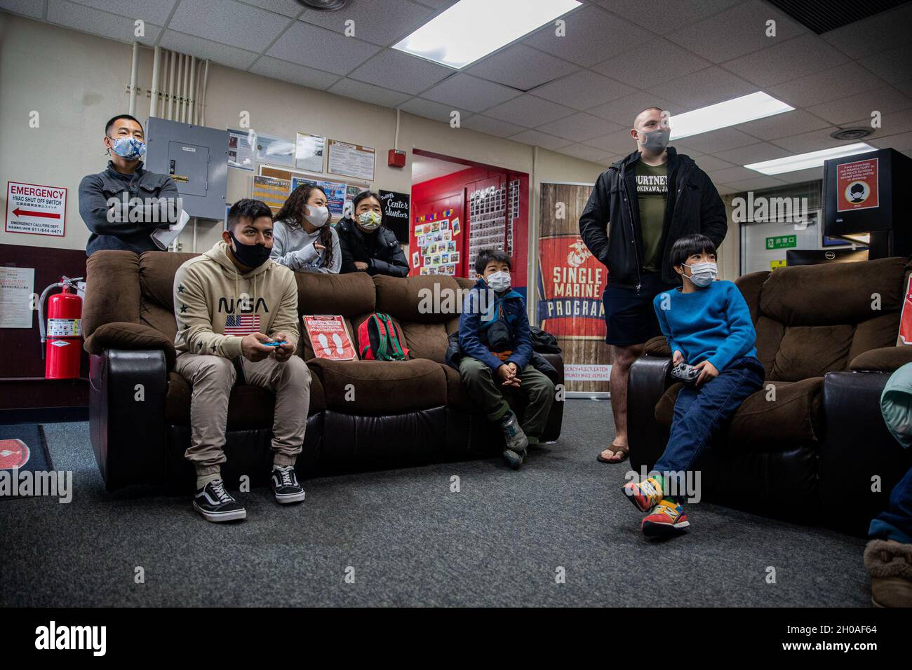 Volunteers with Single Marines Program (SMP) play games after an Uruma City clean up at Camp ...