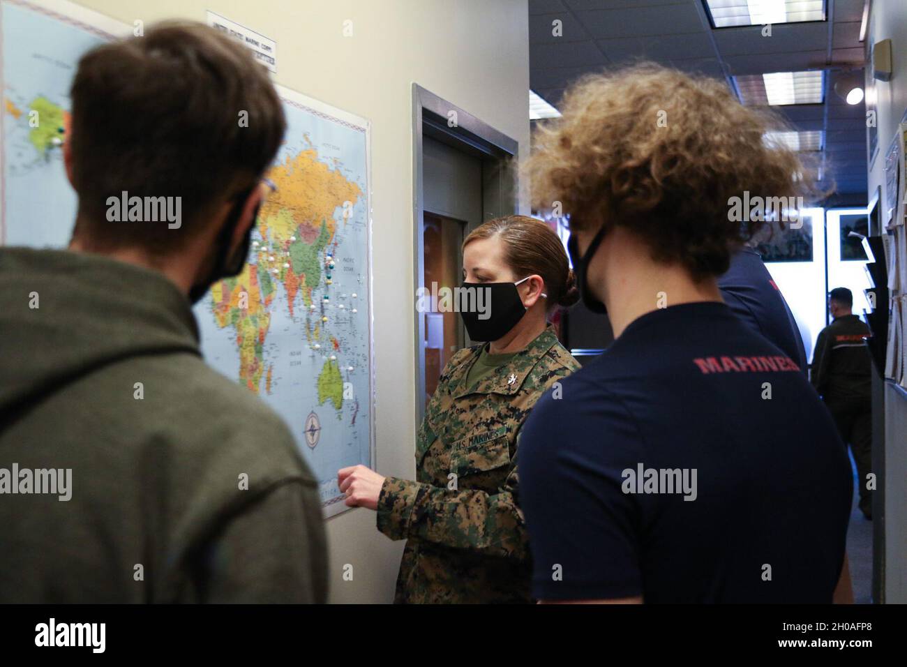 U.S. Marine Col. Heather Cotoia, center, the commanding officer of the ...