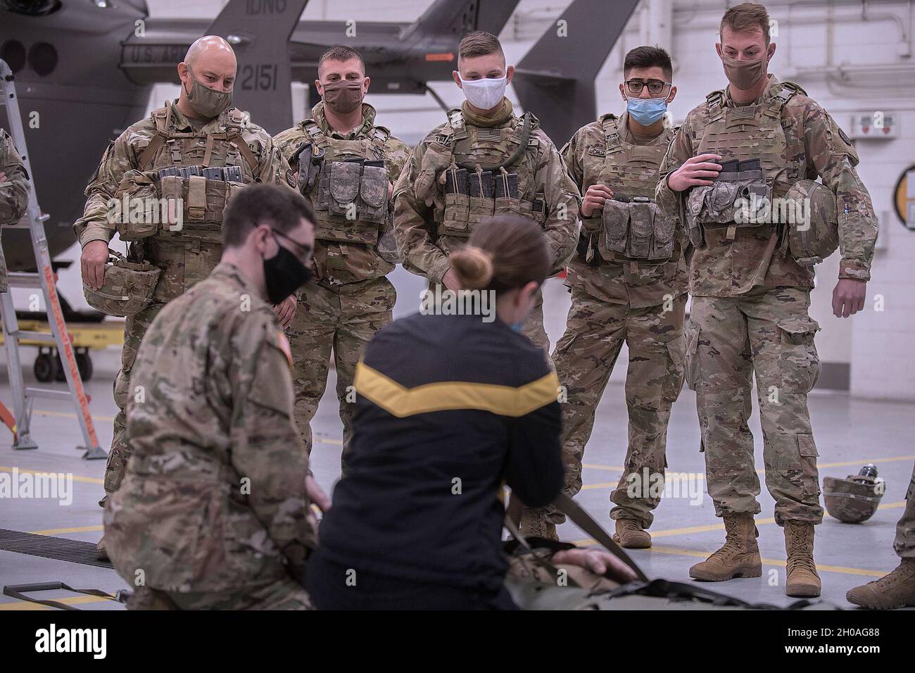 Soldiers from the 2-116th listen to Sgts. Chris Pogue (left) and ...
