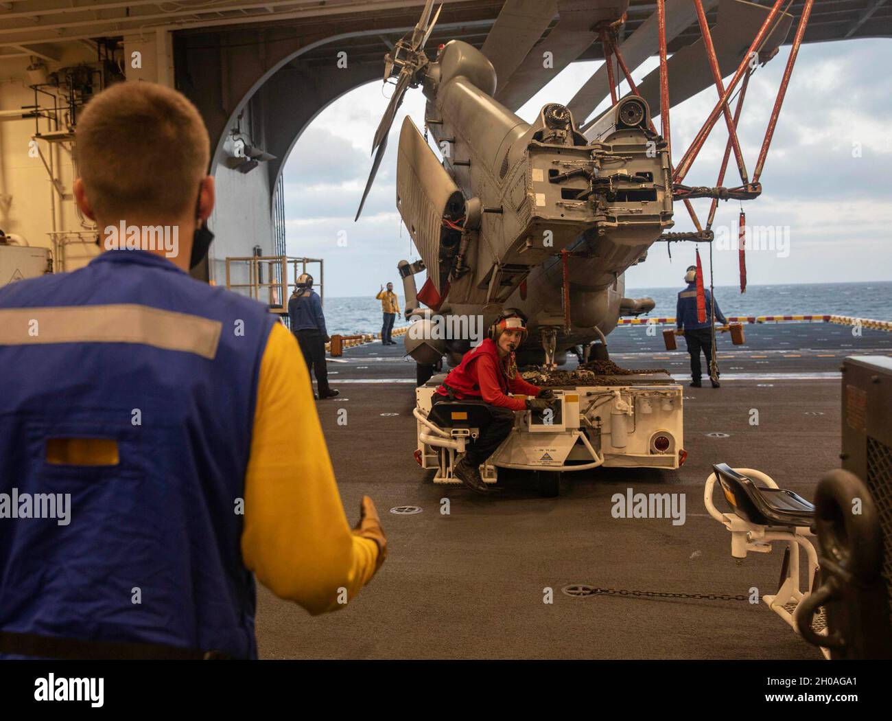 210109-N-LD903-1026 INDIAN OCEAN (Jan. 9, 2021) – U.S. Sailors move an ...