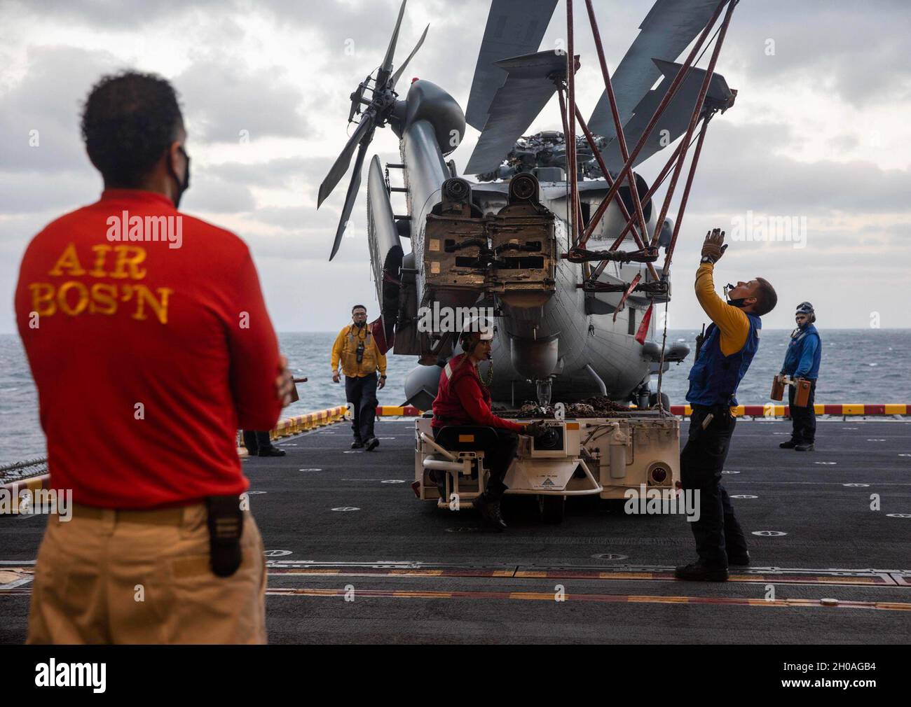 210109-N-LD903-1039 INDIAN OCEAN (Jan. 9, 2021) – U.S. Sailors move an ...