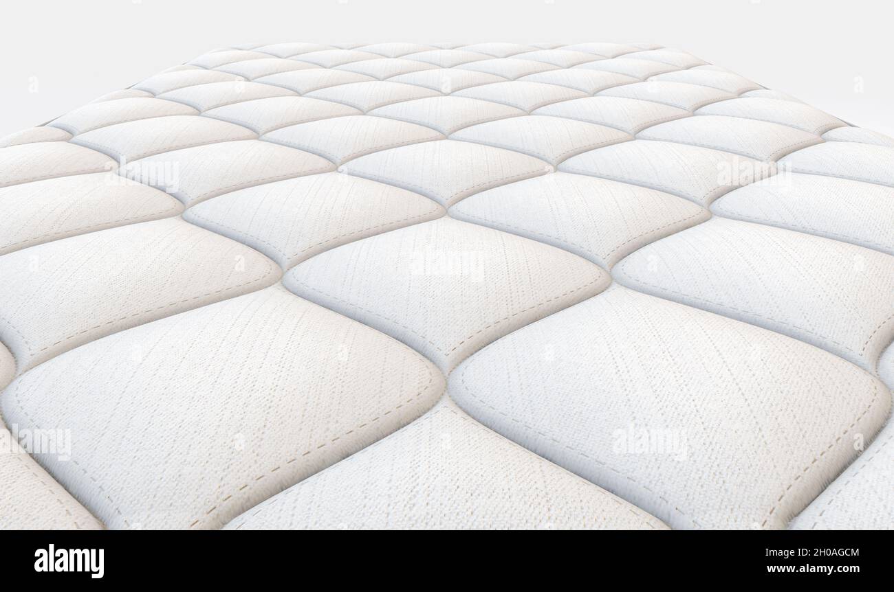 A simple white bed mattress with a decorative topping and fabric sides ...