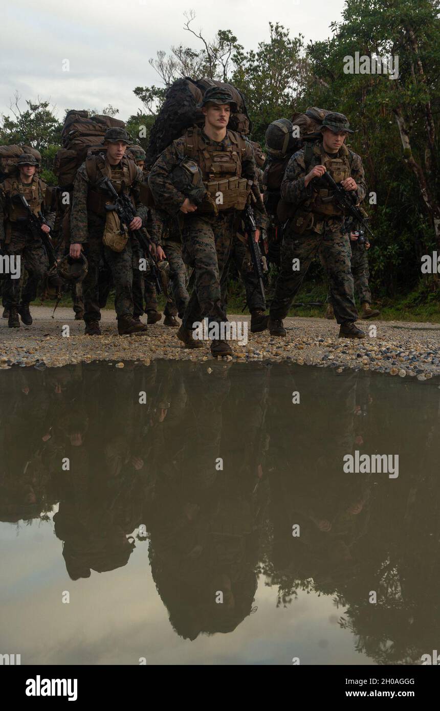 U.S. Marines with 3d Marine Division hike to back to their bivouac ...
