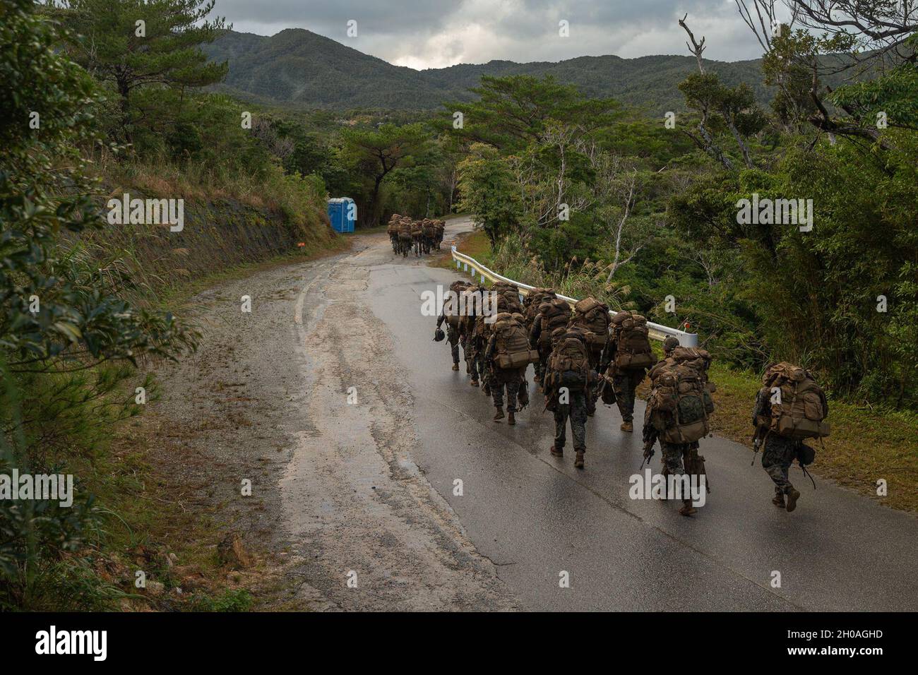 U.S. Marines with 3d Marine Division hike to back to their bivouac ...