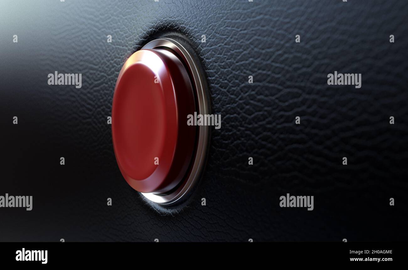 A closeup of a round red button set in a black leather textured surface ...