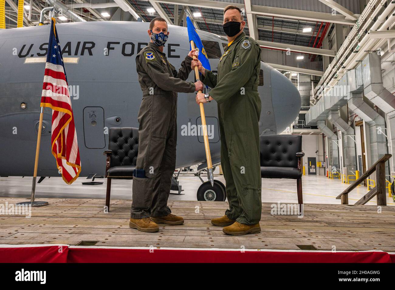 Col. John Robinson, 911th Airlift Wing commander, passes a guidon to ...
