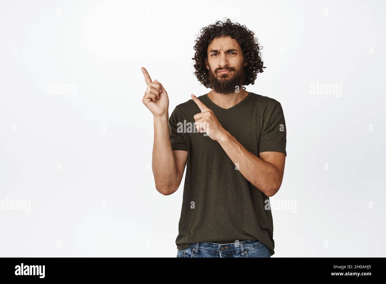 Displeased middle-easter guy, pointing fingers at upper left corner ...