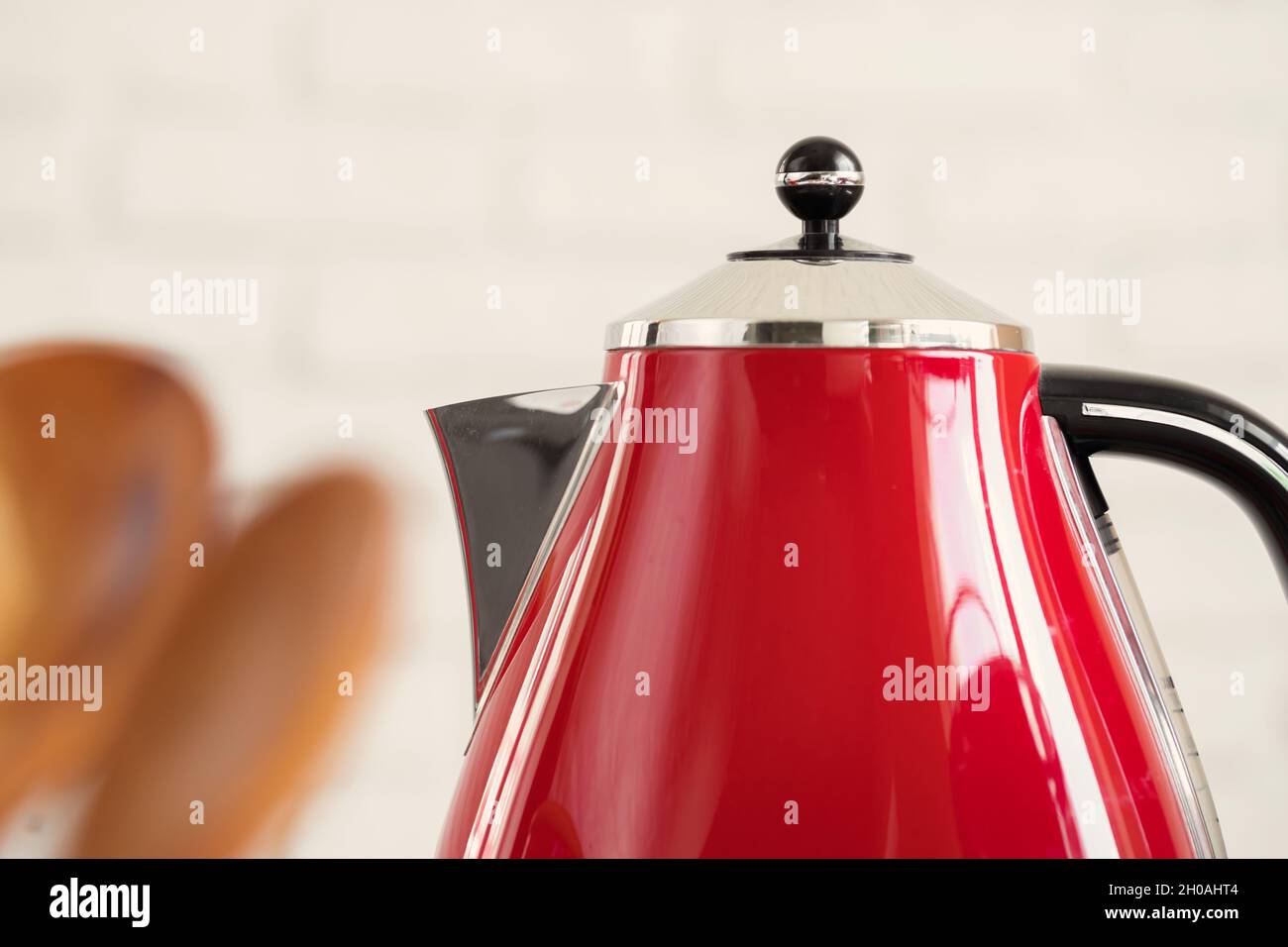 Vintage style red electrical teapot in kitchen interior Stock Photo - Alamy