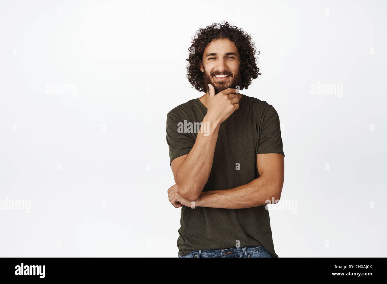Portrait of thoughtful handsome middle-eastern man, smiling and looking ...