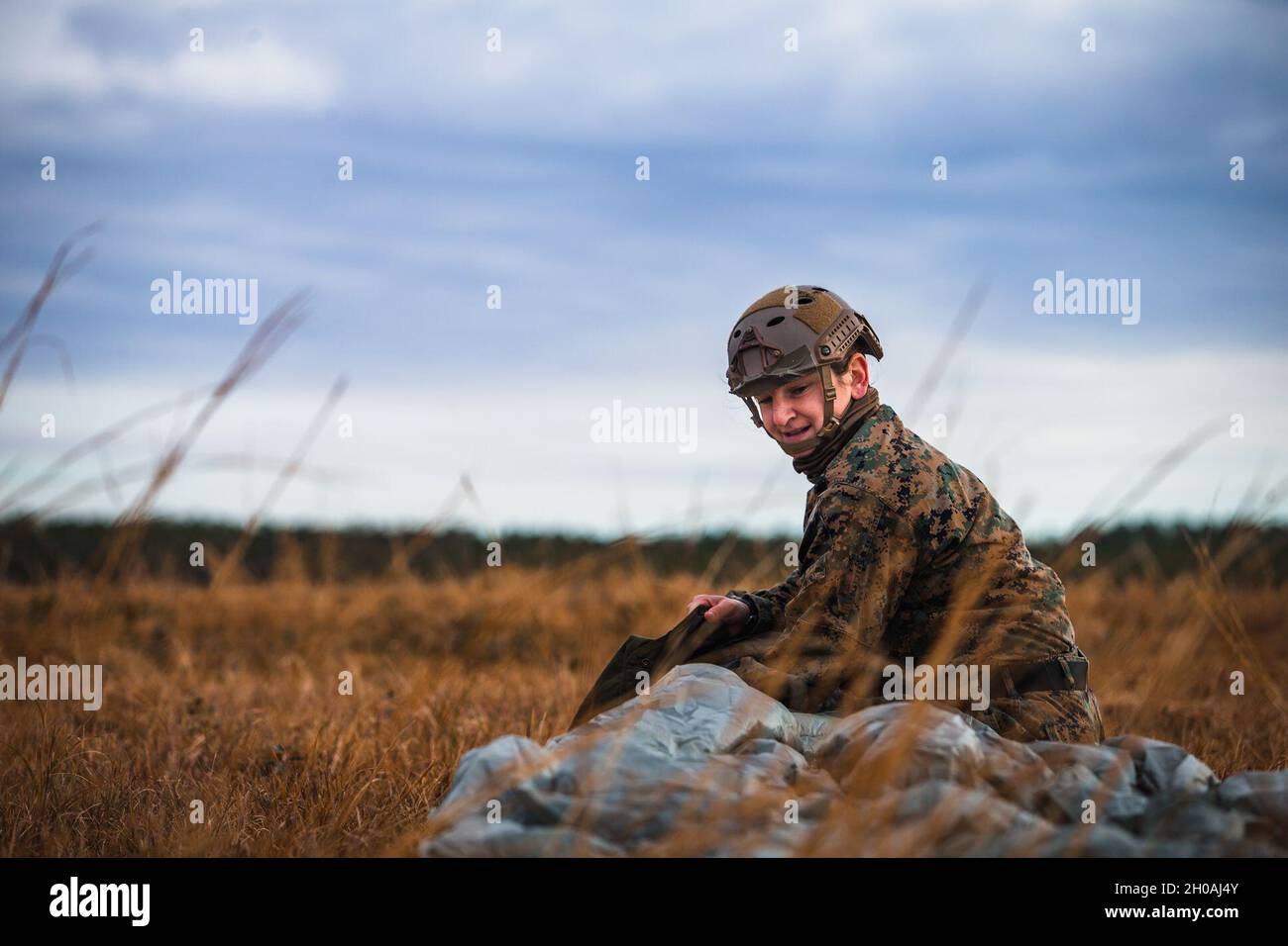 U.S. Marine Corps Capt. Sarah Hutchinson repacks her parachute after ...