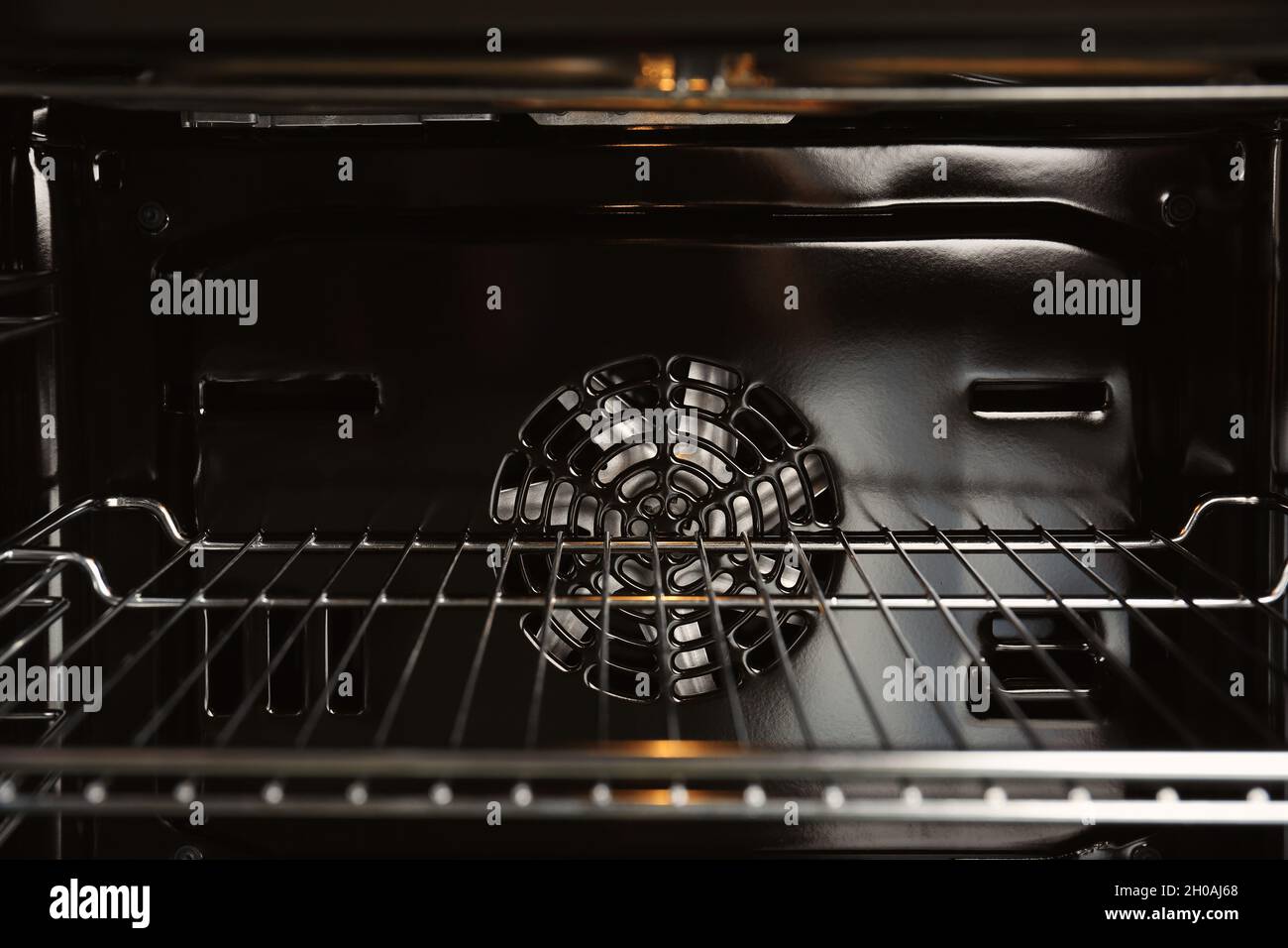 Open empty electric oven with rack, closeup. Inside view Stock Photo ...
