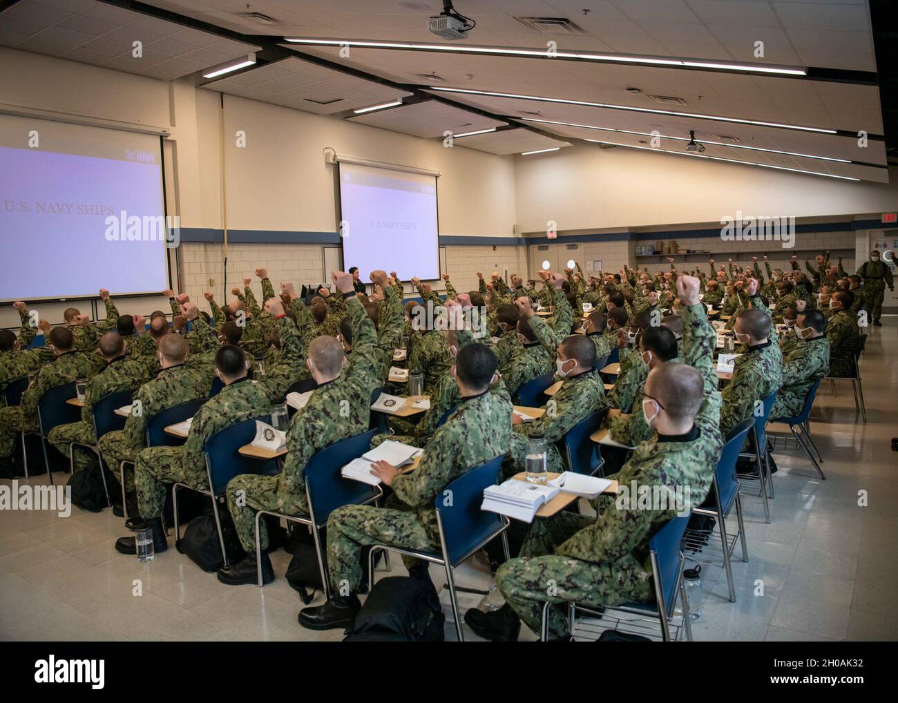 Recruits demonstrate a safety procedure before a classroom lesson on ...