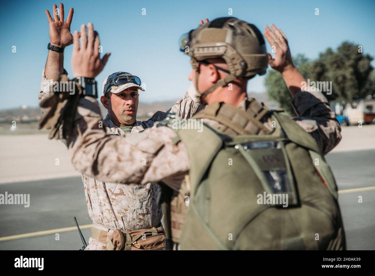 U.S. Marine Corps Master Sgt. Miguel Zeran, left, a reconnaissance ...