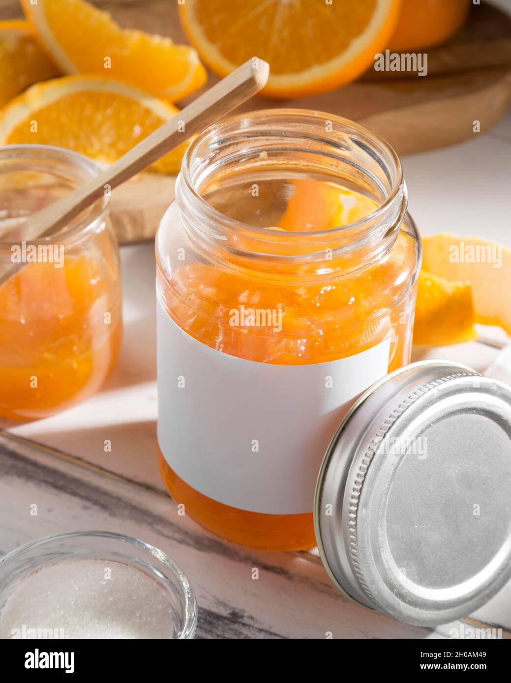 High angle transparent glass jar with orange jam Stock Photo - Alamy