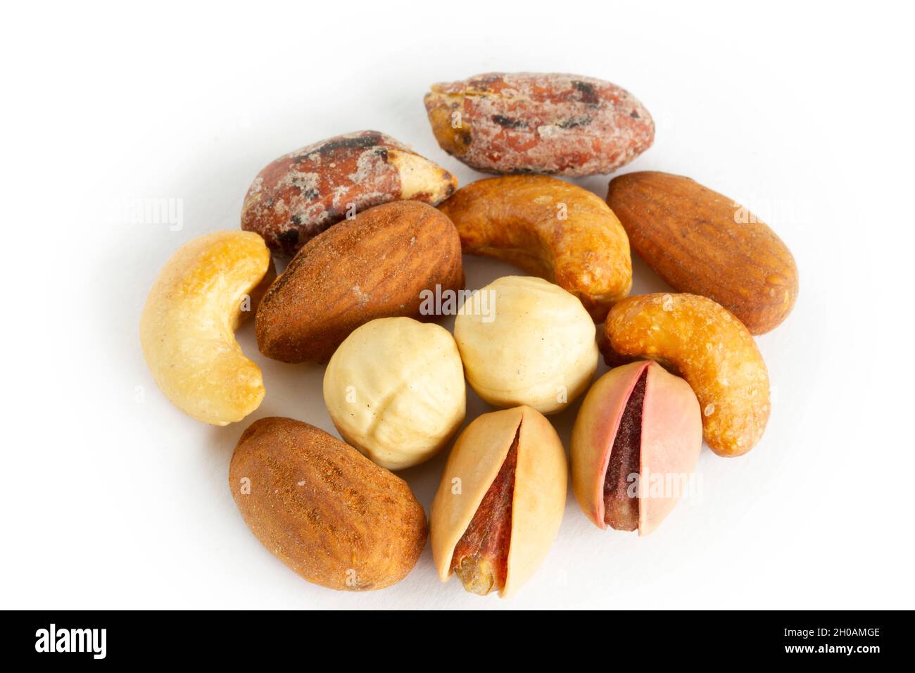 Mixing nuts isolated in white background Stock Photo - Alamy