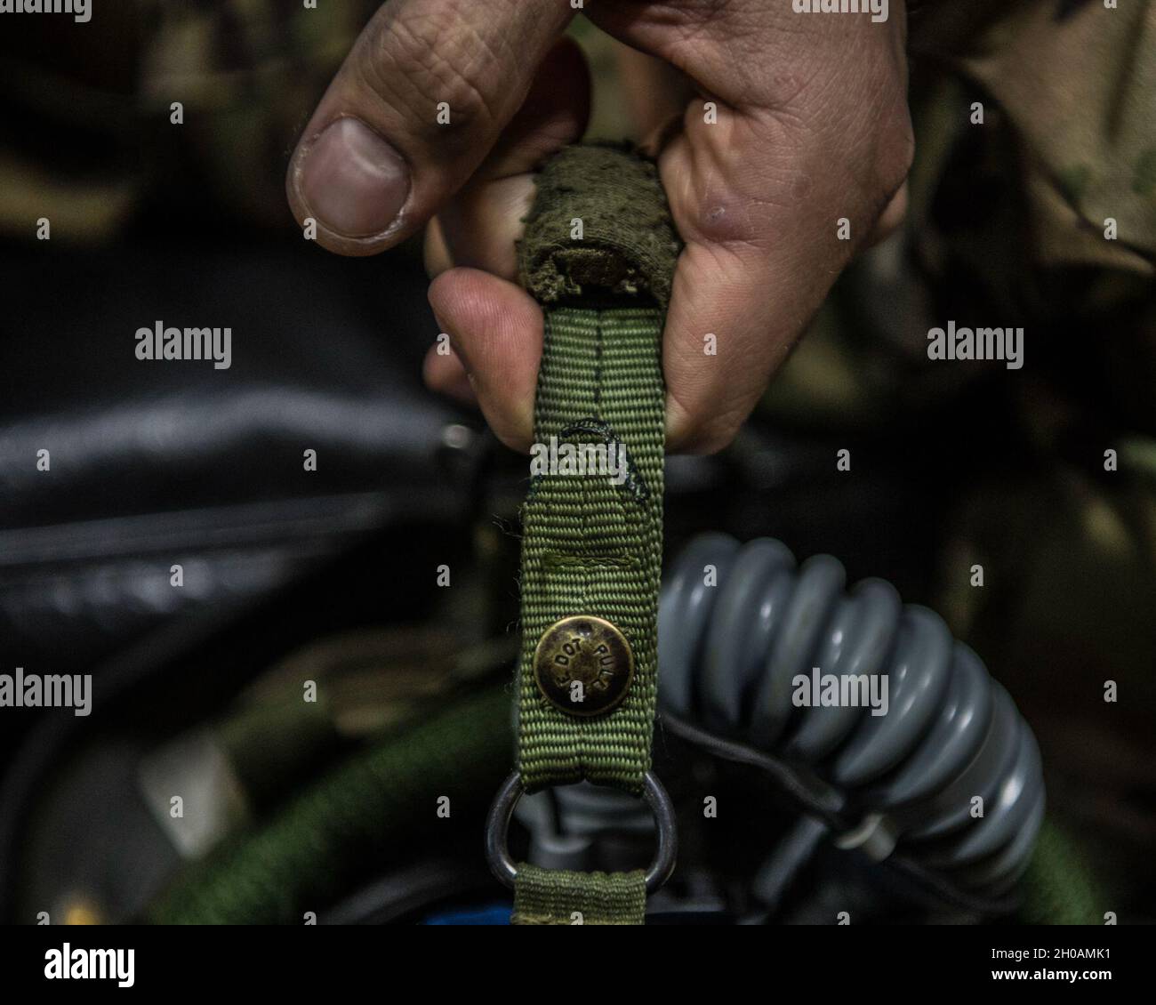 A flight engineer with the 8th Special Operations Squadron holds a ...