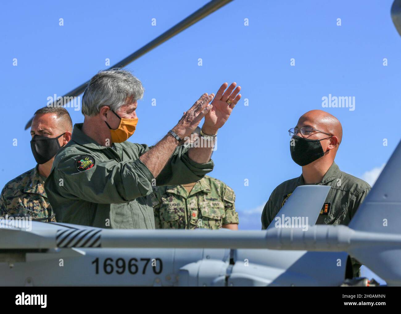 Secretary of the Navy Kenneth J. Braithwaite, left, talks with U.S. Marine Corps Chief Warrant ...