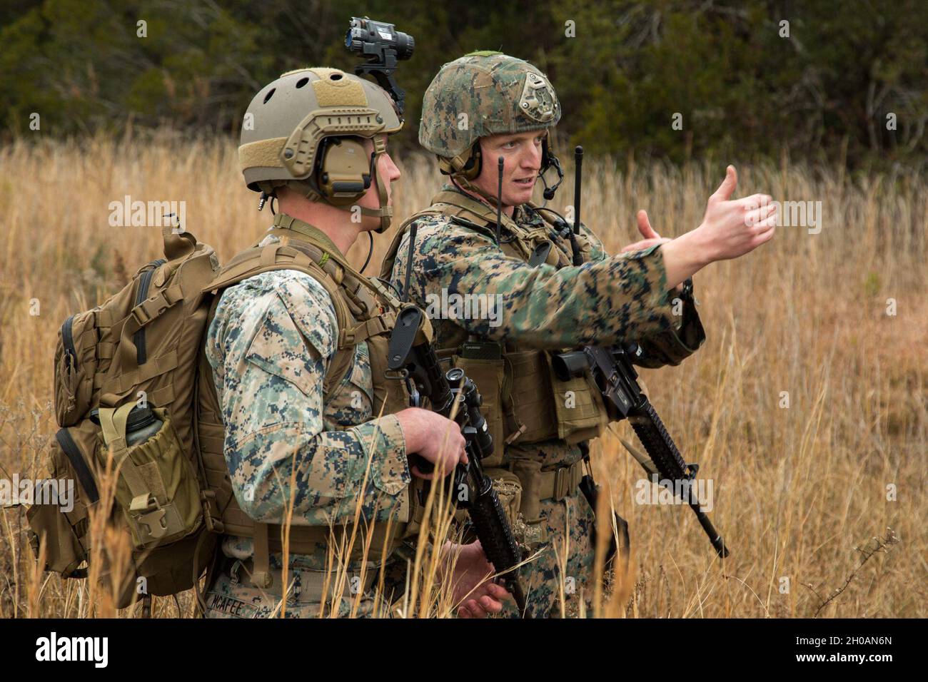 U.S. Marine Corps Capt. William Myers, a field artillery officer, right ...