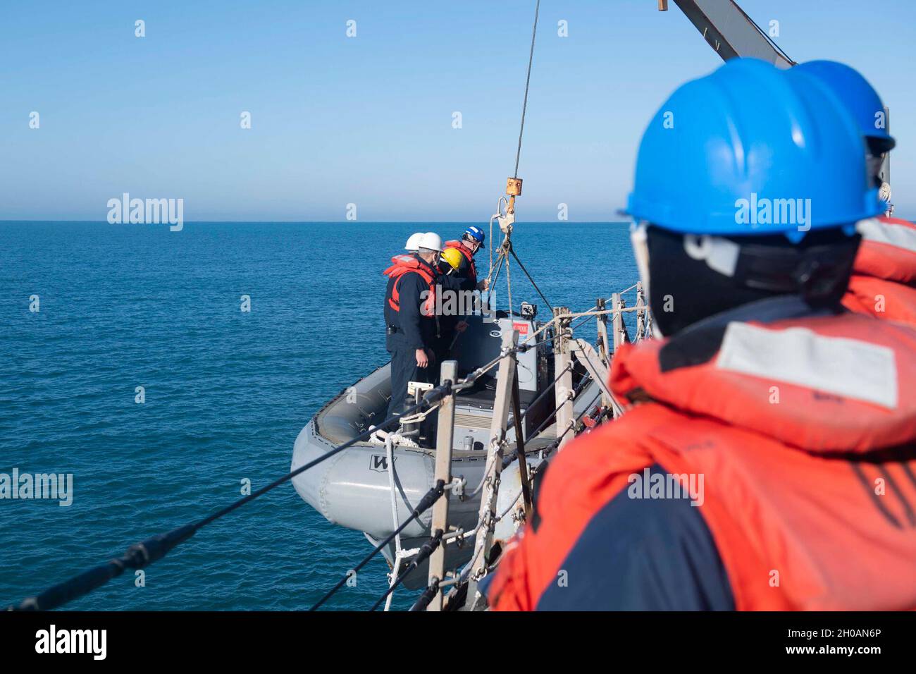 Rigid hull inflatable boat lowered from hi-res stock photography and ...