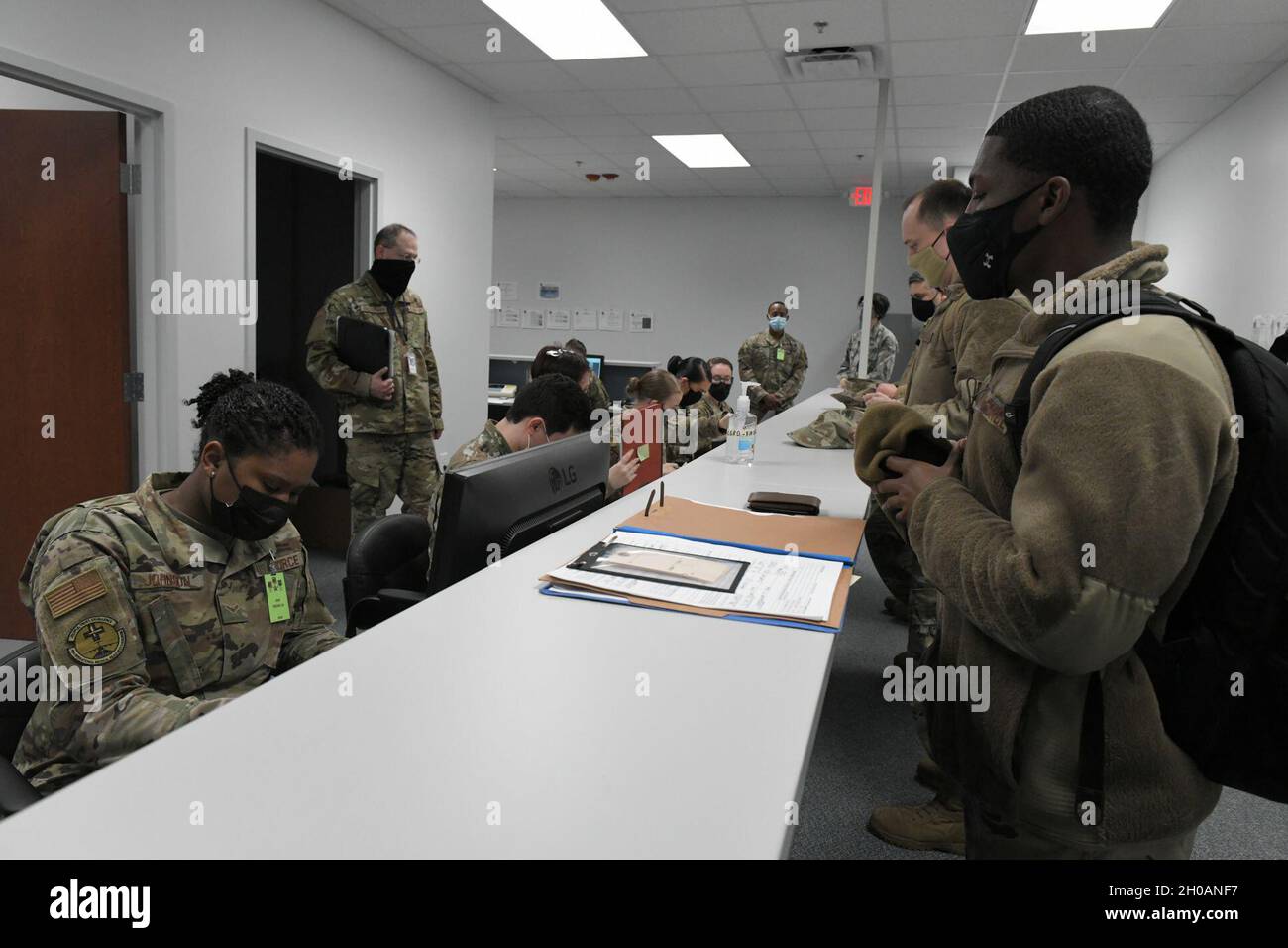 Staff Sgt. Caleb York (right), 78th Security Forces Squadron, check in ...