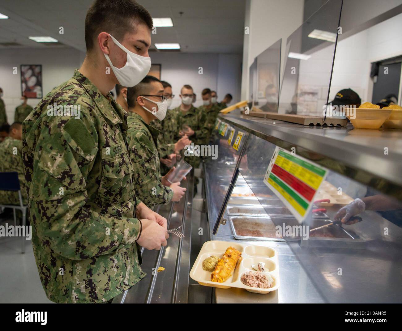 Recruits go through the chow line in the galley of the USS Marvin ...