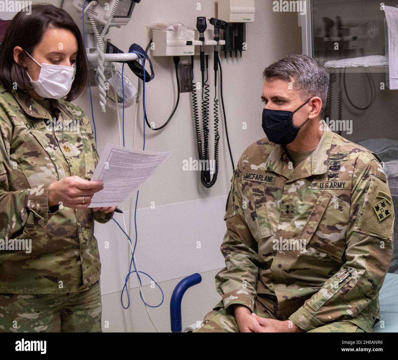 Maj. Chandra Punch, the Allergy and Immunology Clinic chief (left) reviews Maj. Gen. Matthew W ...