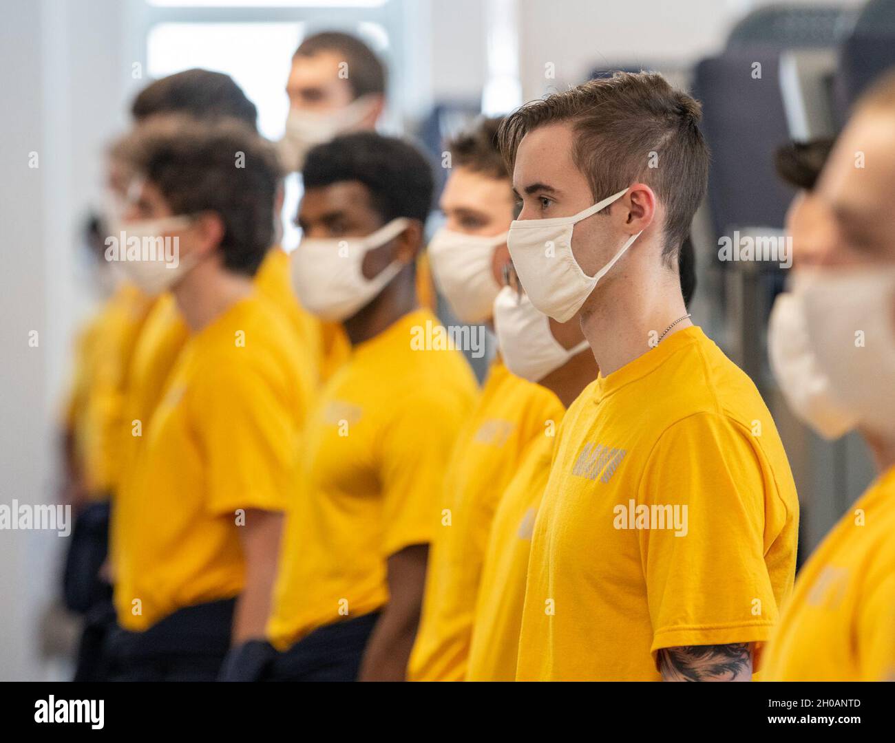 Recruits listen to instructions from a recruit division commander ...