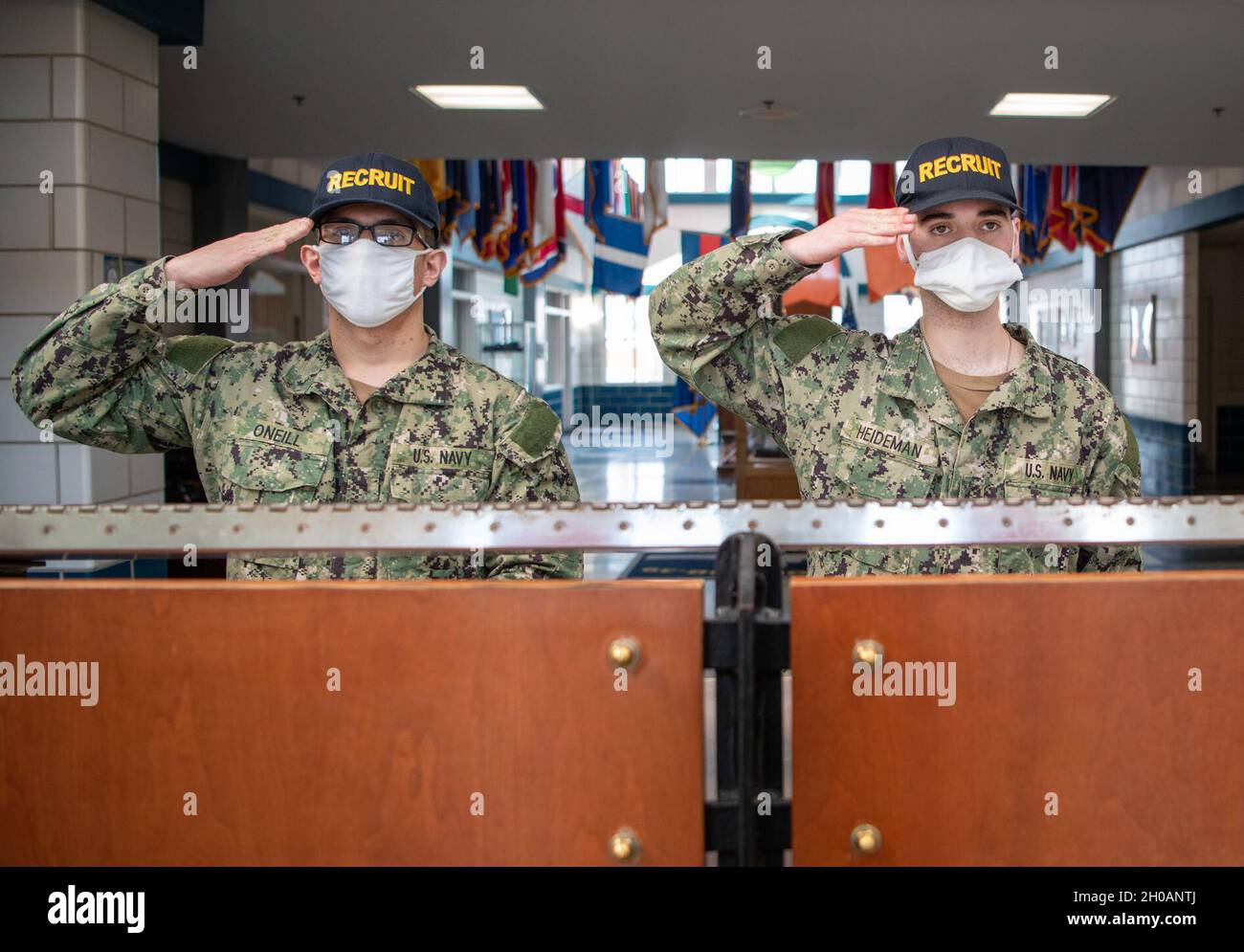 Recruits render a salute while standing watch inside the USS Arizona ...