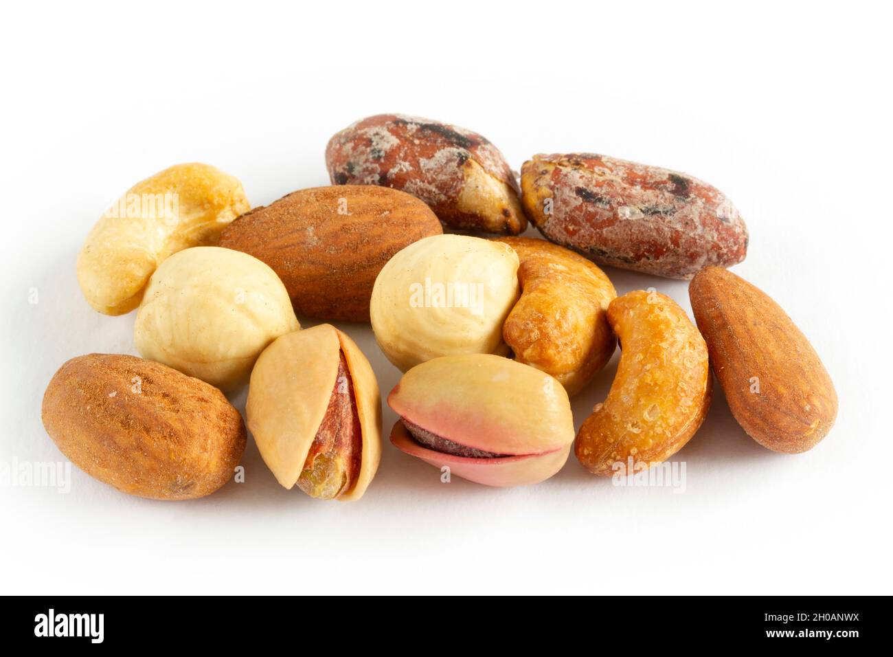 Mixing nuts isolated in white background Stock Photo - Alamy