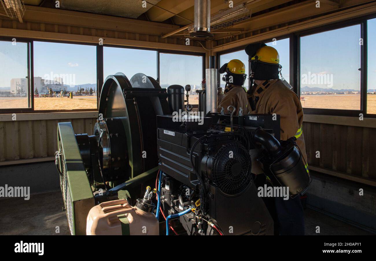 Fire fighters assigned to the 374th Civil Engineer Squadron fire ...