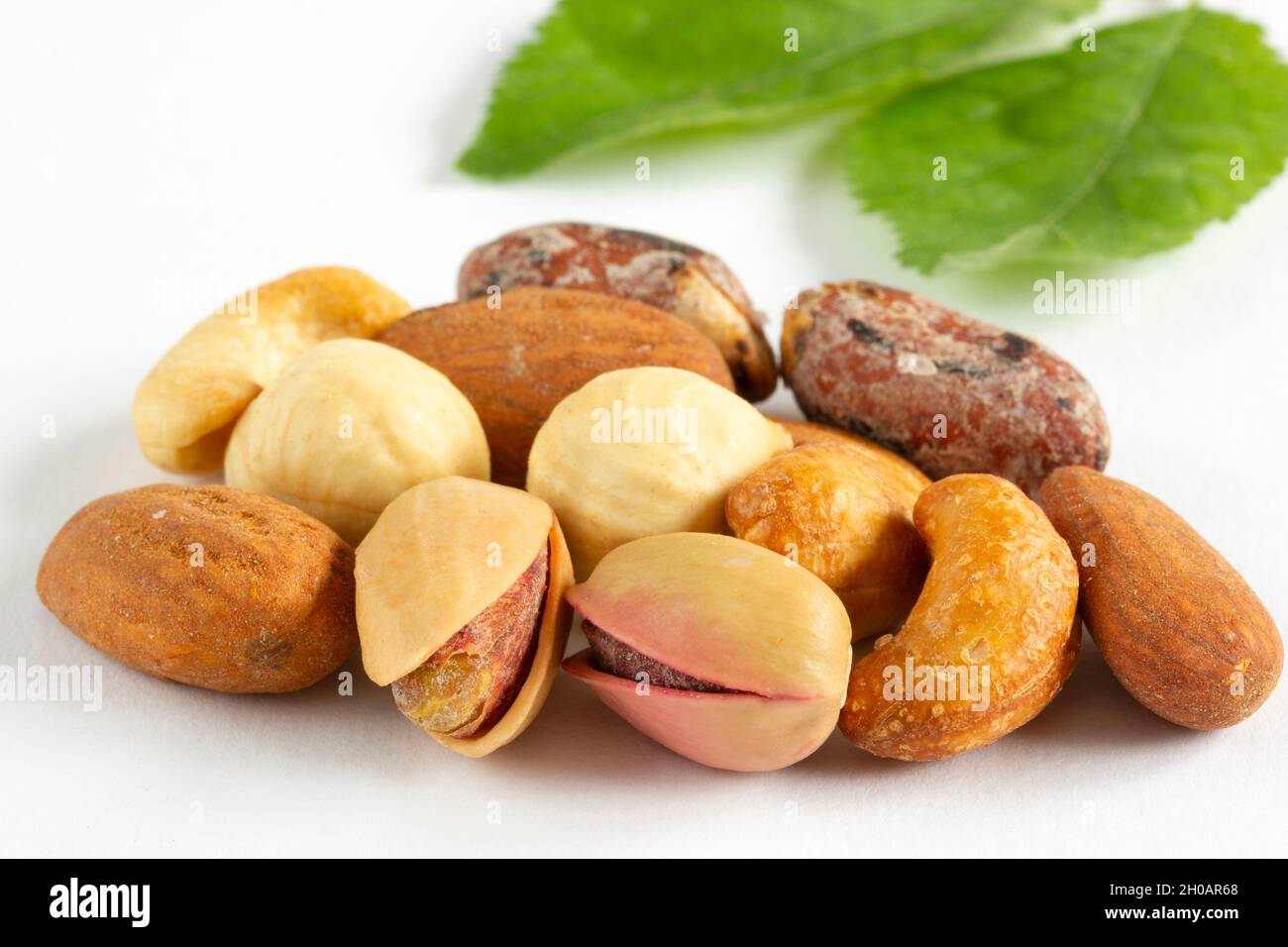 Mixing nuts isolated in white background Stock Photo - Alamy