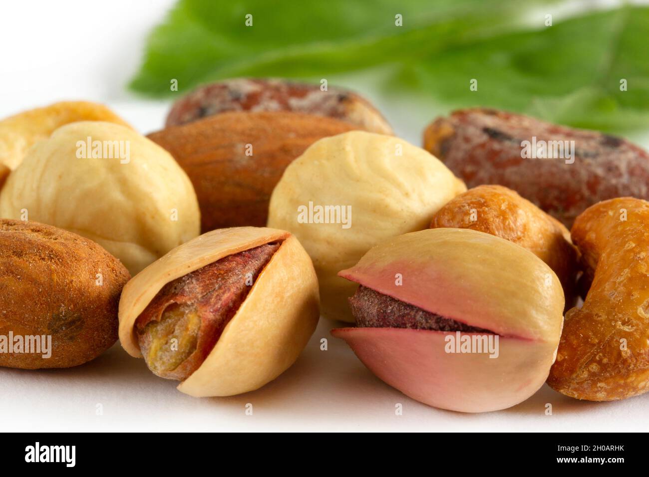 Mixing nuts isolated in white background Stock Photo - Alamy