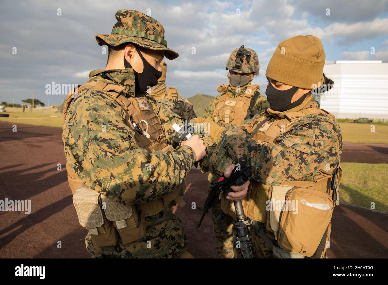 U.S. Marine Corps Lance Cpl. Revelation Maa, right, an administrative ...