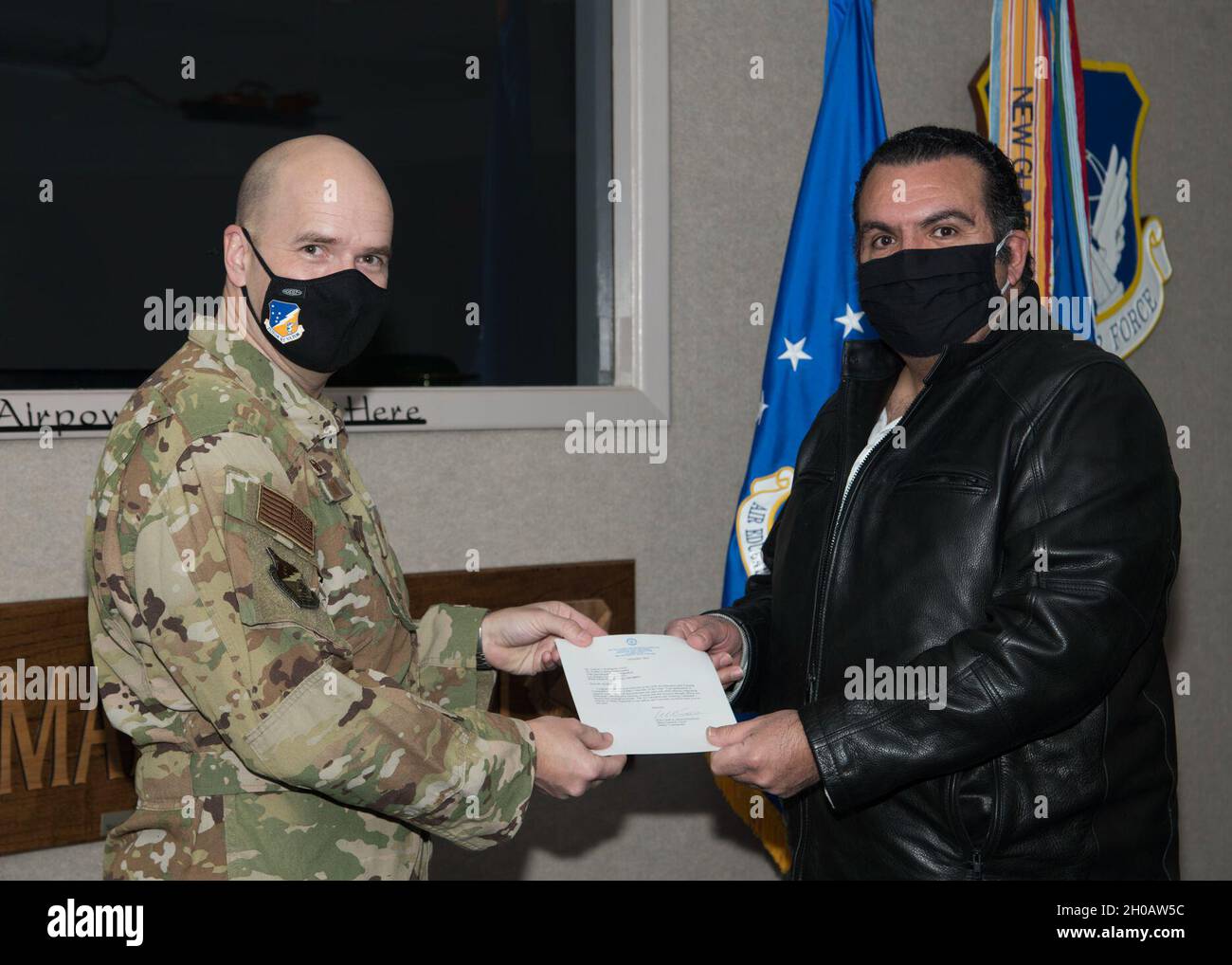 Gilbert Rodriguez, right, 54th Operations Support Squadron, receives ...