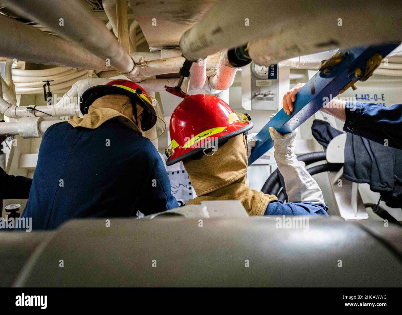 Sailors apply metal shoring to a simulated pipe rupture in the aft ...