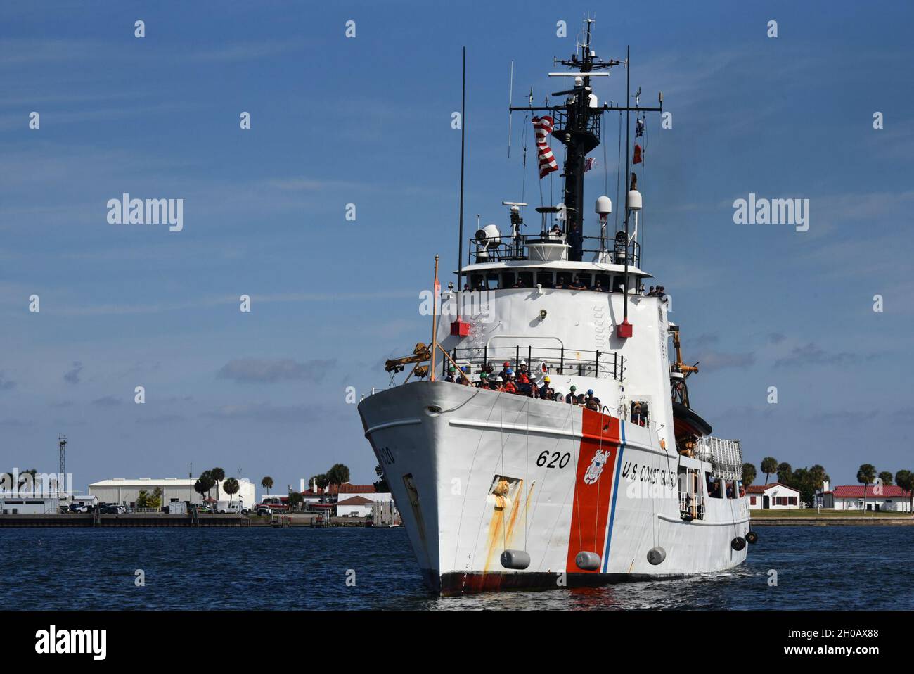 Coast Guard Cutter Resolute (WMEC-620) crewmembers approach to port ...