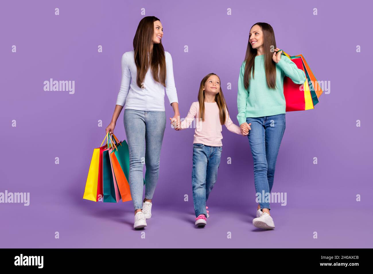 Photo of funny charming mommy two daughters wear casual pullovers ...