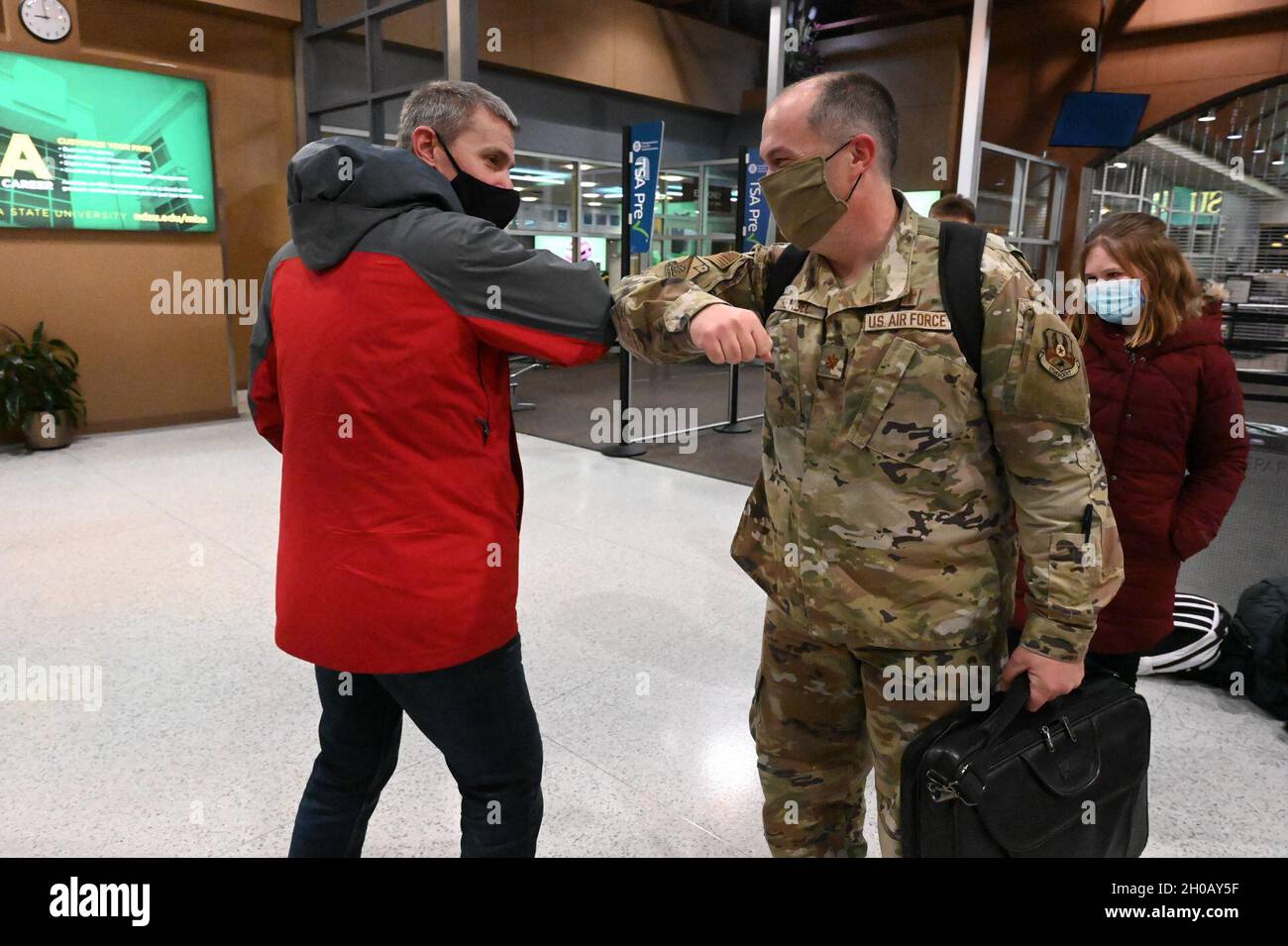 Col. Darrin Anderson, the 119th Wing commander, left, greets Maj ...
