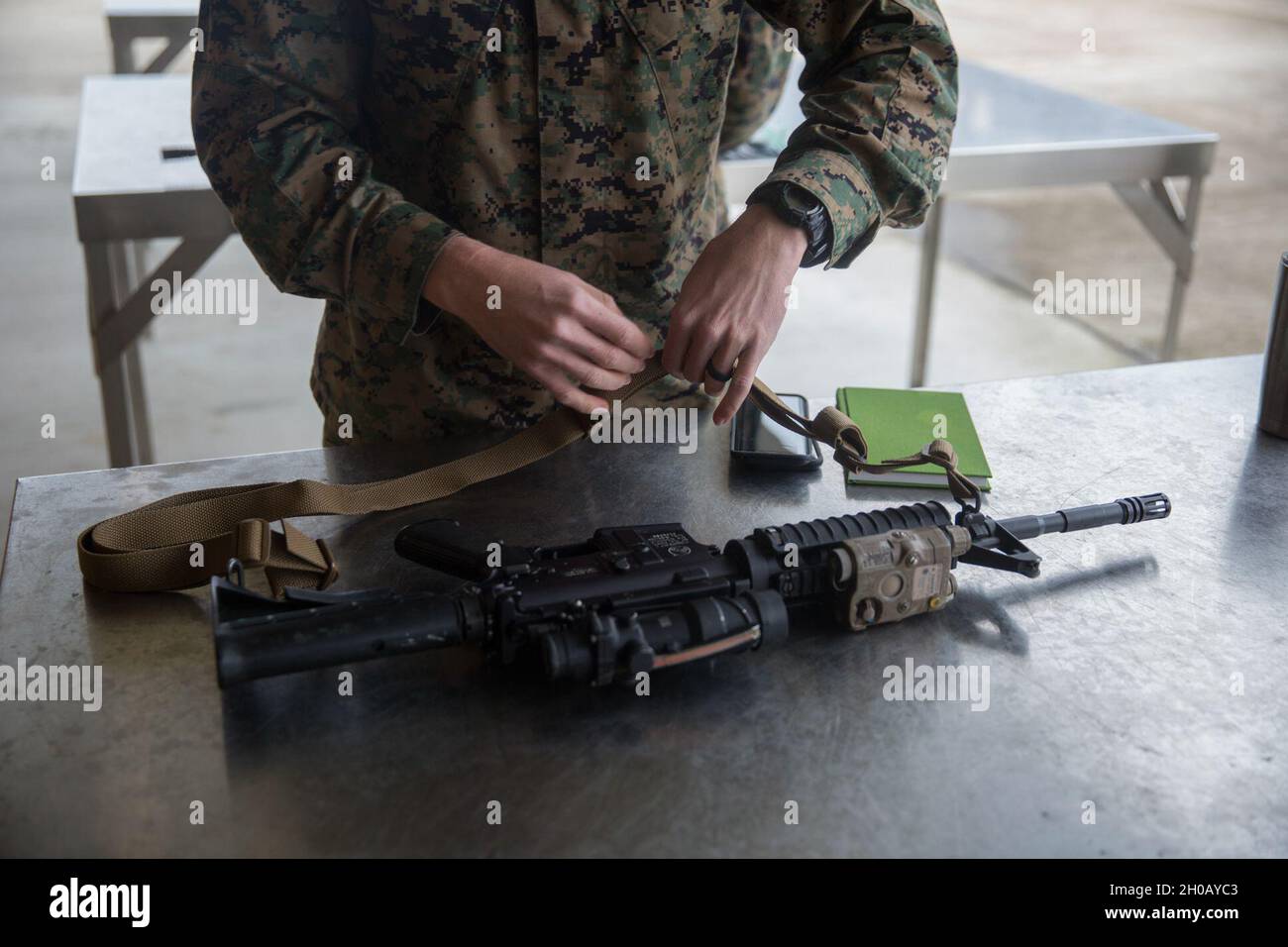 A U.S. Marine with 2nd Marine Expeditionary Brigade (2nd MEB) puts a ...