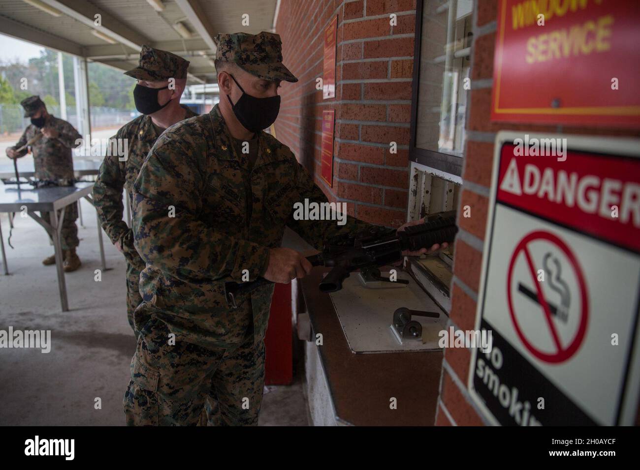 U.S. Marines with 2nd Marine Expeditionary Brigade (2nd MEB) draw their ...