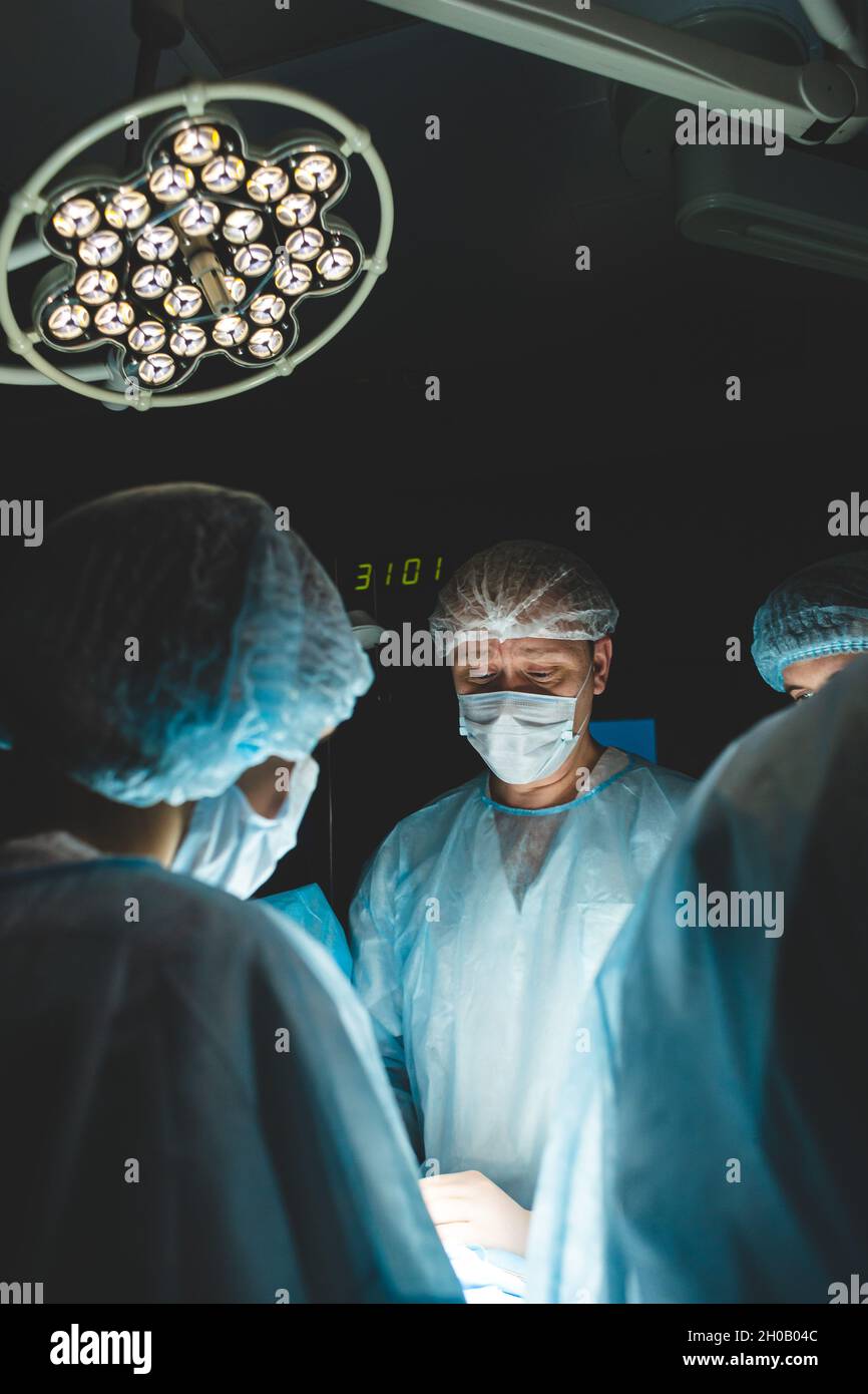 An international professional team of surgeon, assistants and ...