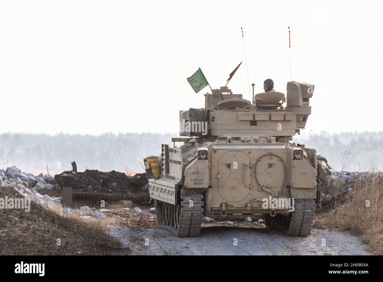 Tank crews assigned to the 1st Battalion, 115th Infantry Regiment ...