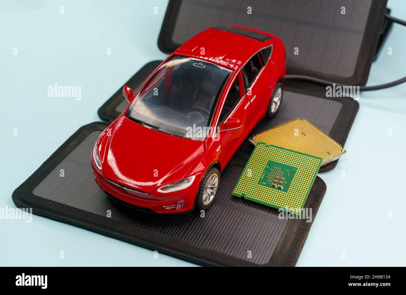 Solar powered electric car and charging concept Stock Photo - Alamy