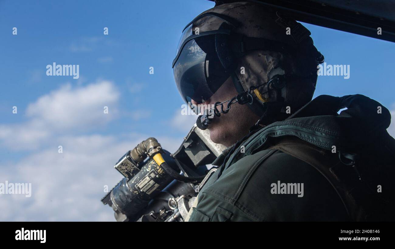 U.S. Marine Corps Gunnery Sgt. Scott Schamber, an aerial observer, with ...